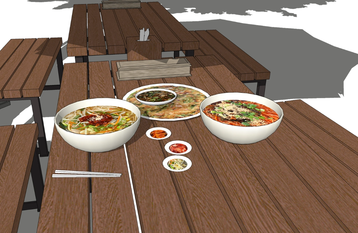 Table set with noodles and green onion pancakes